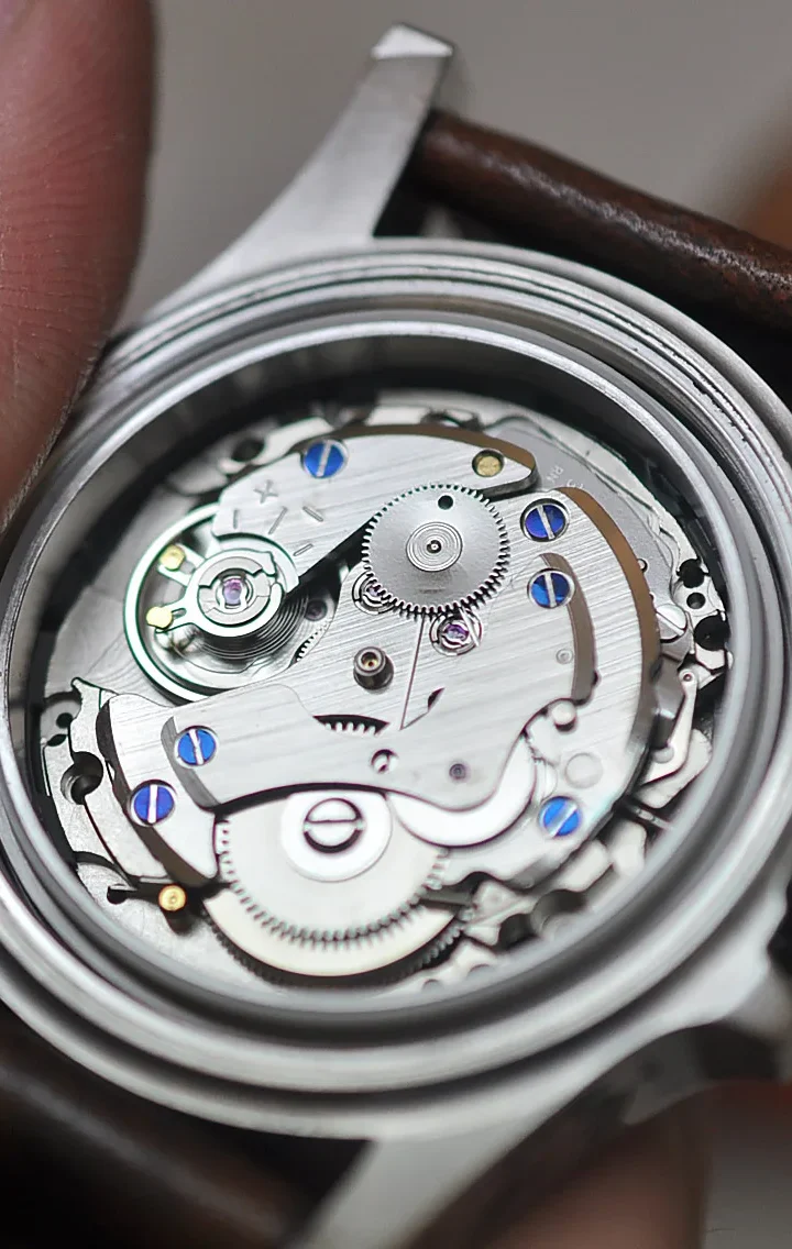 What is the Purpose of Blued Screws in Watch Movements?